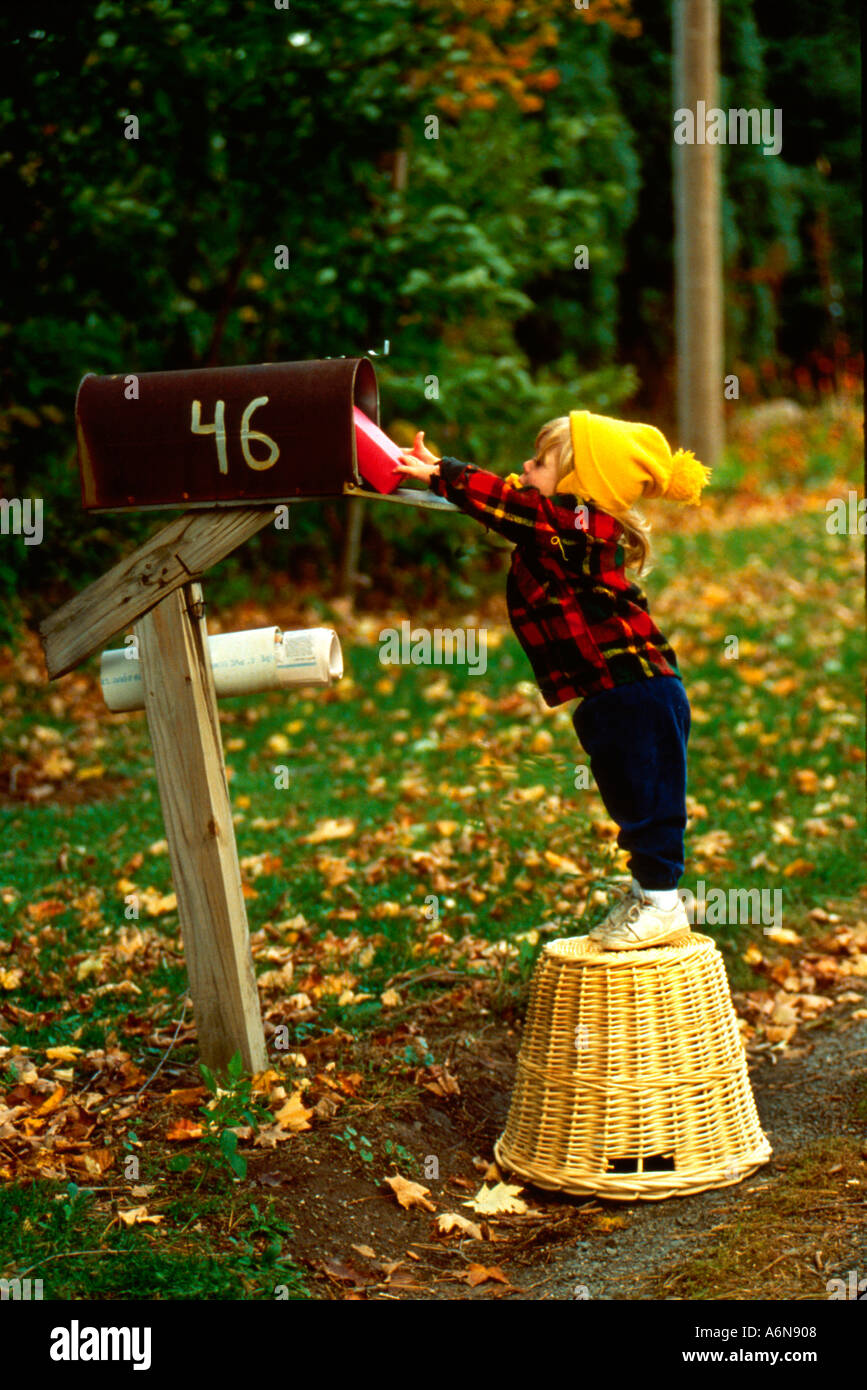 Little girl getting mail Stock Photo - Alamy