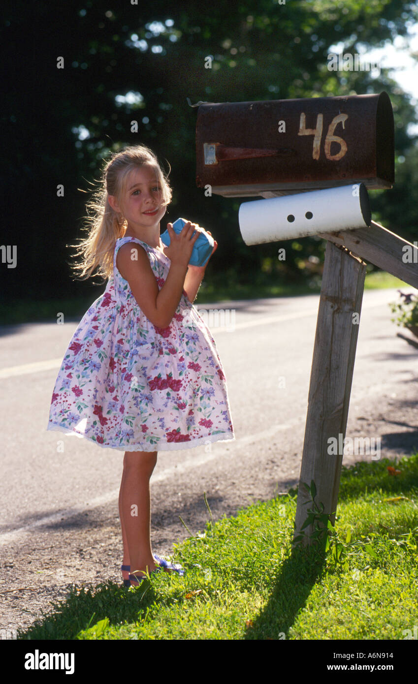 Little girl getting mail Stock Photo - Alamy