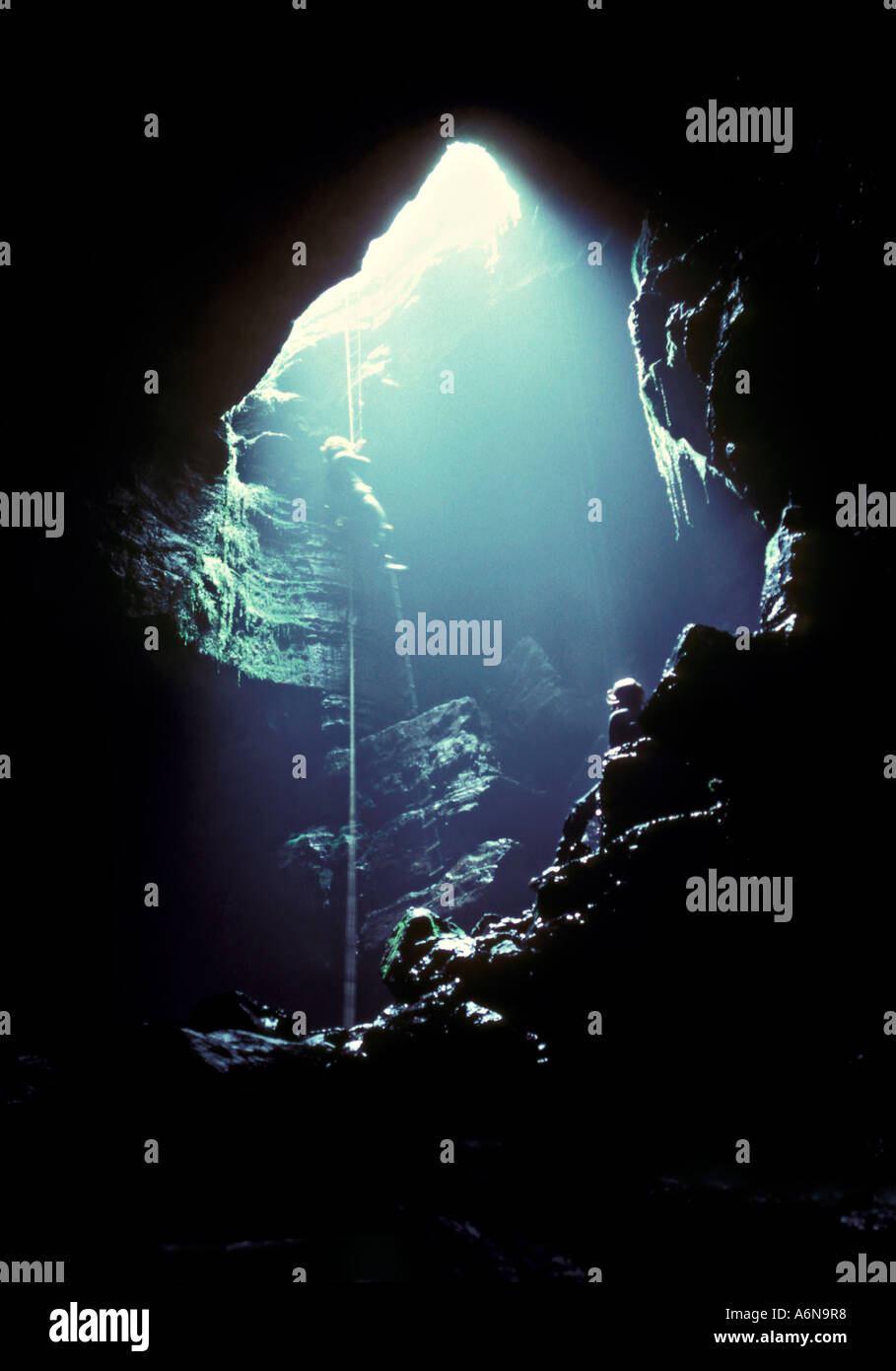 Two cavers in the entrance shaft of a pothole Wales UK Stock Photo - Alamy