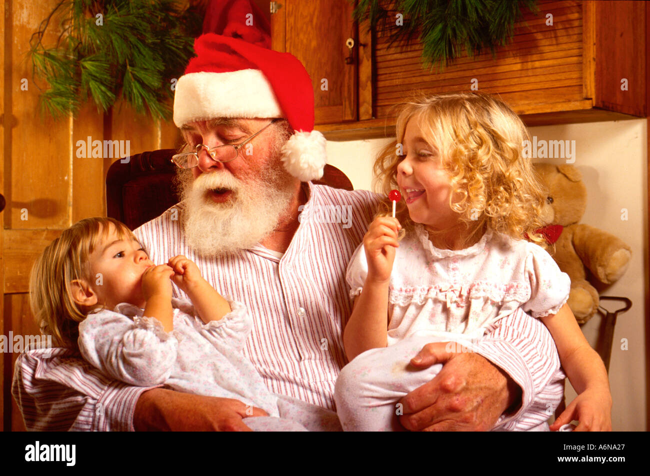 Santa Claus with children Stock Photo - Alamy