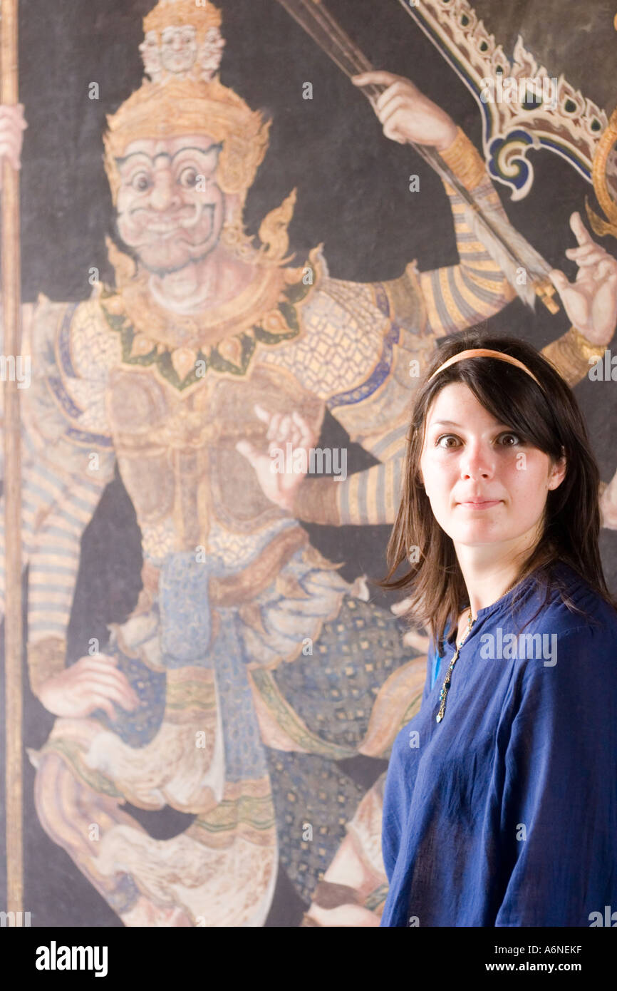 Western tourist posing in front of a mural in The Grand Palace Stock ...