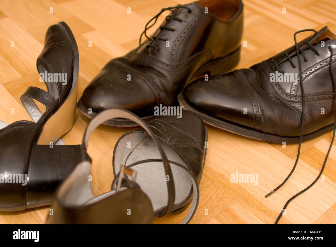 Black shoes on wooden floor Stock Photo - Alamy