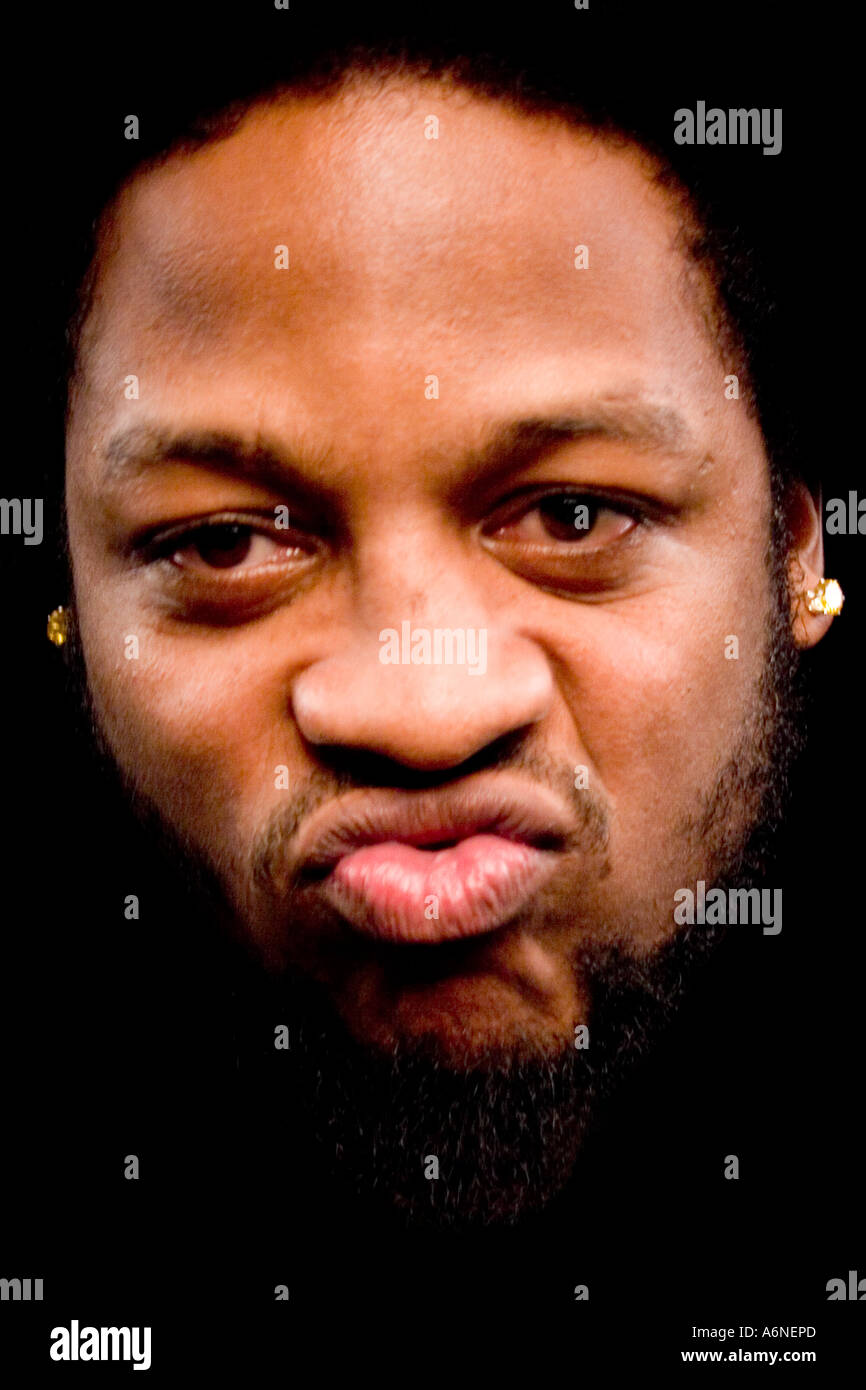 Black man making a face at the camera Stock Photo - Alamy