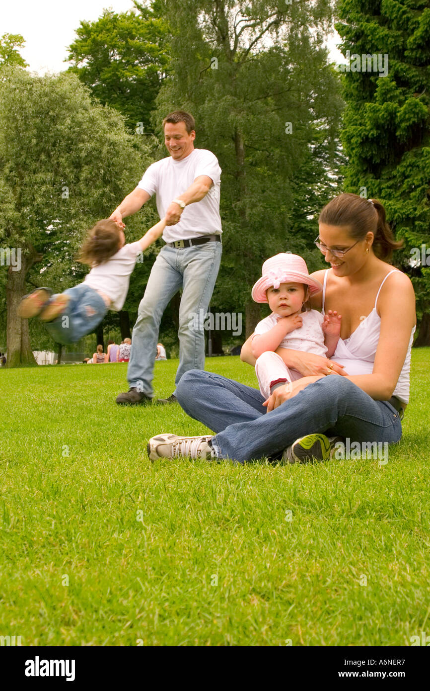 Family playing with children in park Stock Photo - Alamy