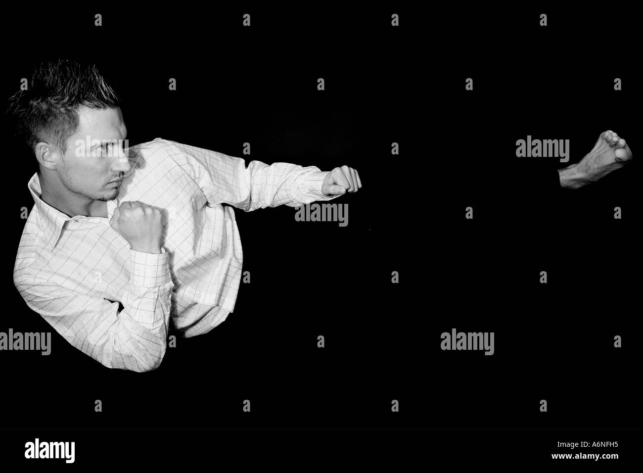 Martial arts artist doing a sidekick Stock Photo - Alamy