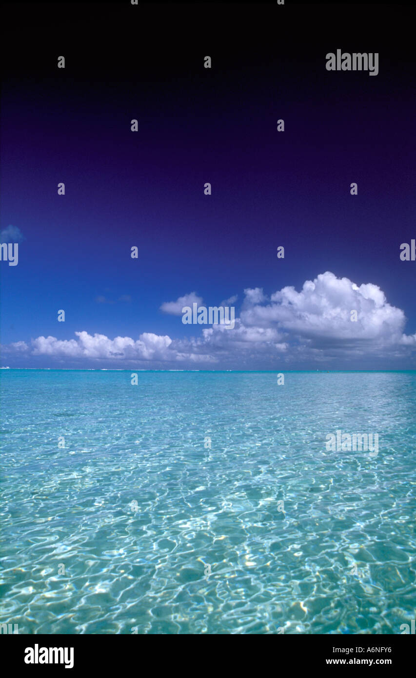 Peaceful crystal clear lagoon with small clouds, French Polynesia Stock ...