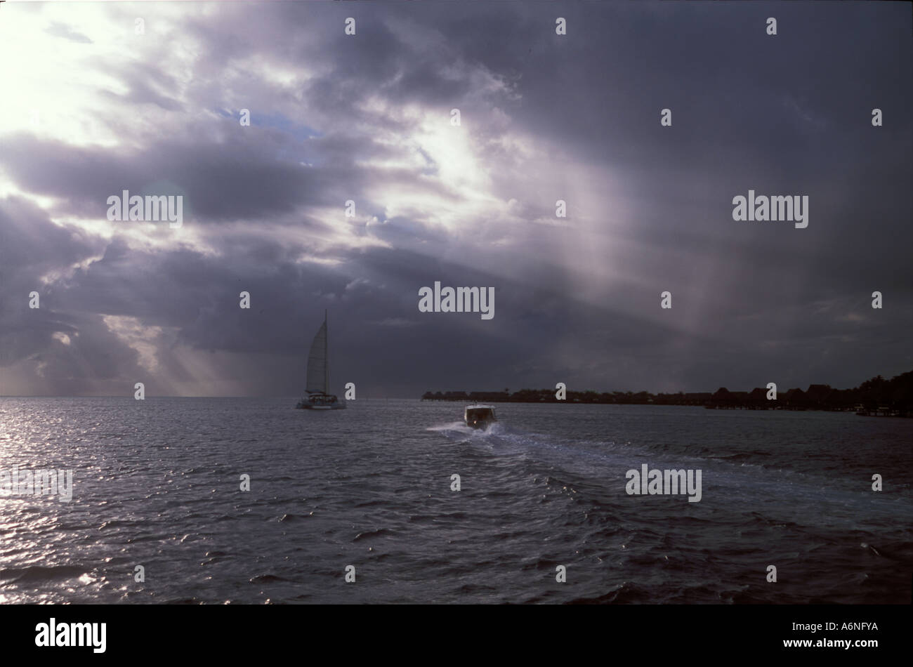 Sailing into celestial light and storm, Polynesia Stock Photo - Alamy