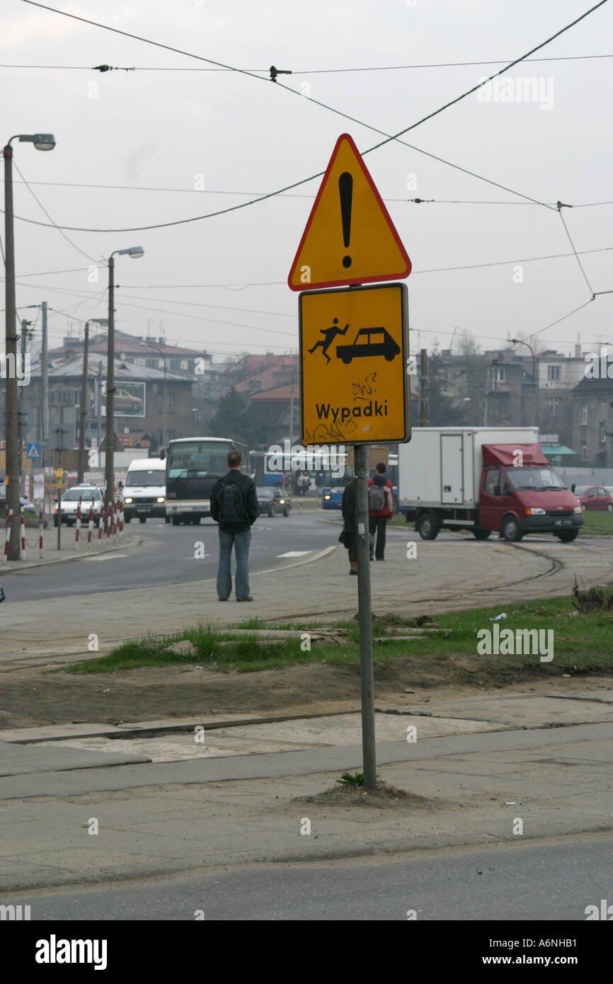 Warning sign to pedestrians in Krakow Poland Stock Photo - Alamy