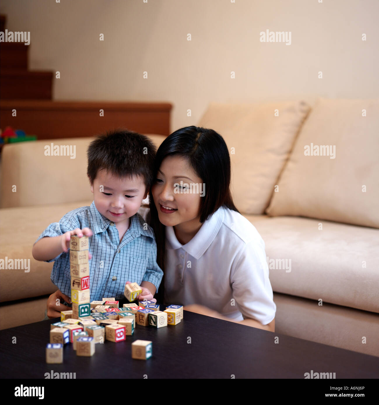 Mother and son playing block games Stock Photo - Alamy