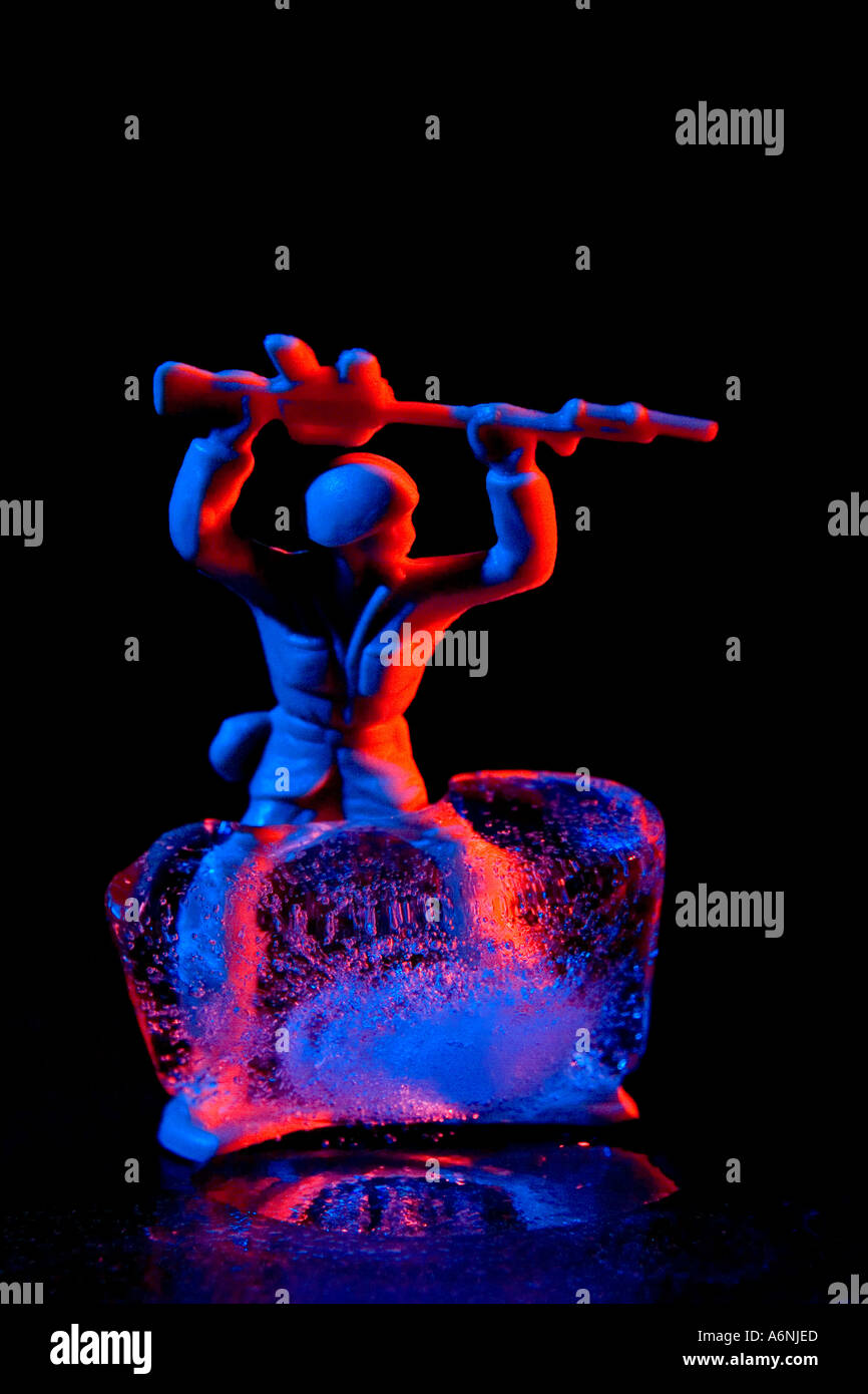 Closeup of toy army man in ice illustrating millitary freeze, or war ...