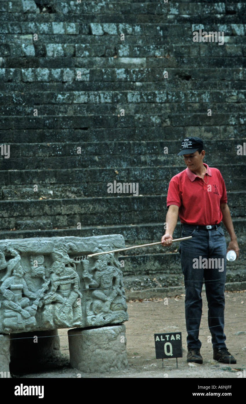 Local archaeological guide indicating detail on the west face of the ...