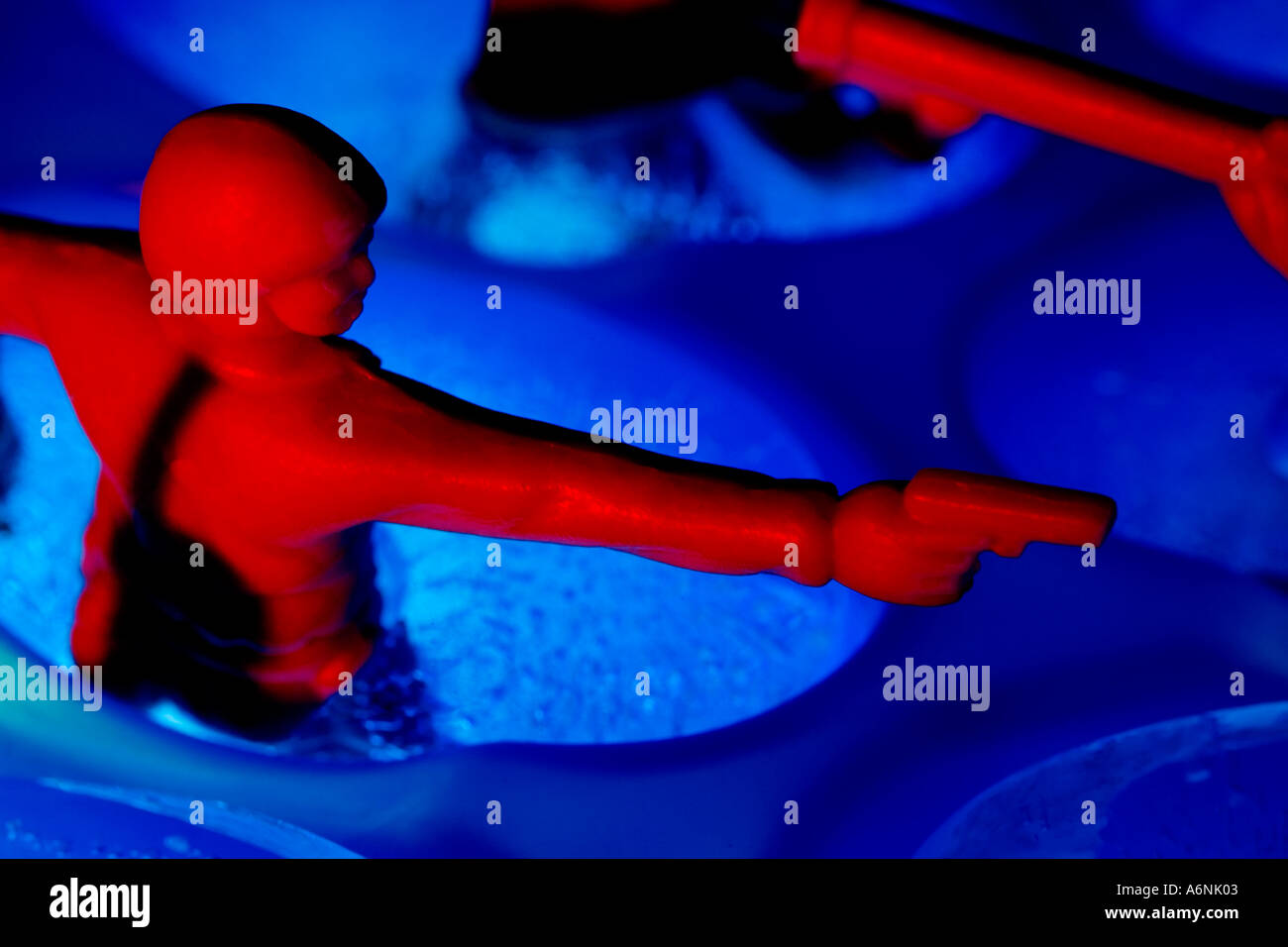 Closeup of toy army men in ice illustrating millitary freeze, or war ...