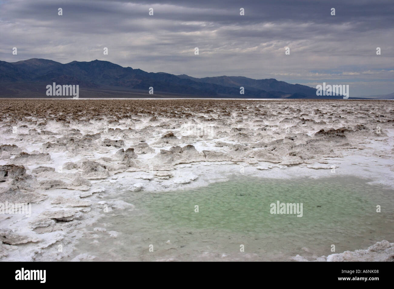 Dry lake in Death Valley with large salt deposits which now cover basin ...