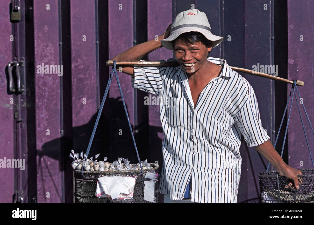 Friendly Balinese street vendor selling quail eggs Ubud market Bali ...
