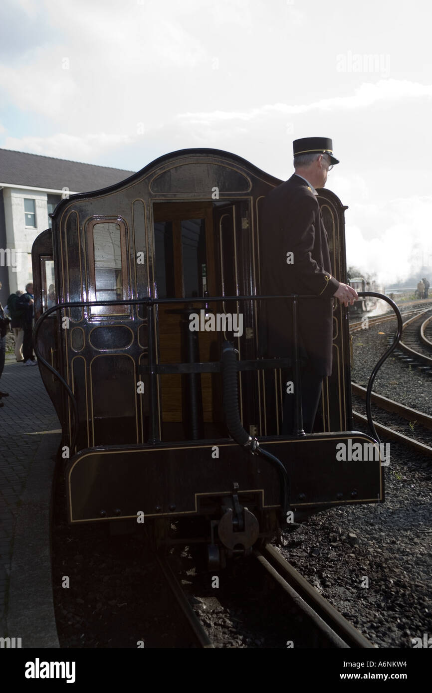 Victorian train guard on the Ffestiniog railway, on a steam train ...