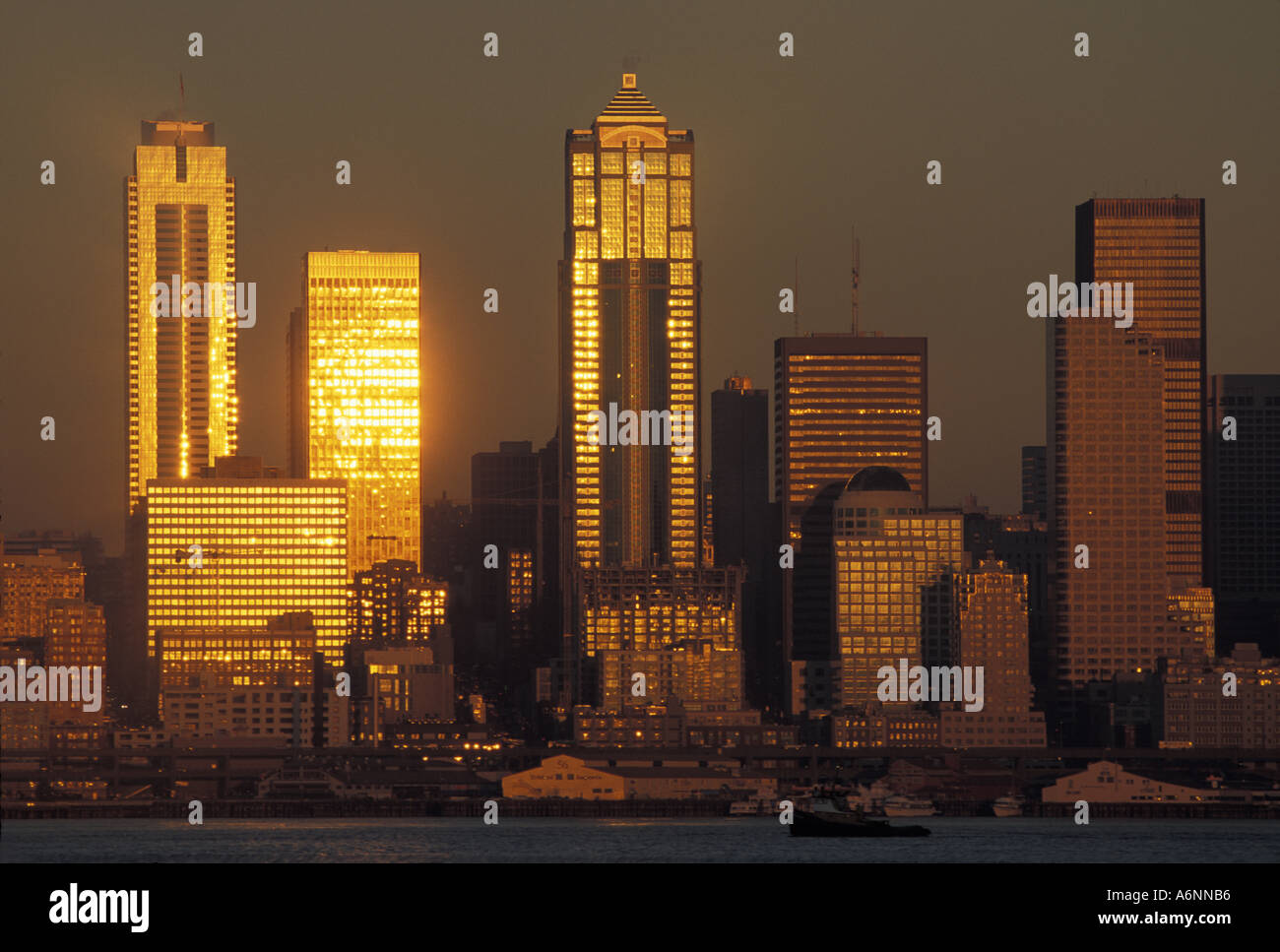 USA Washington Seattle Setting sun reflects off downtown office ...