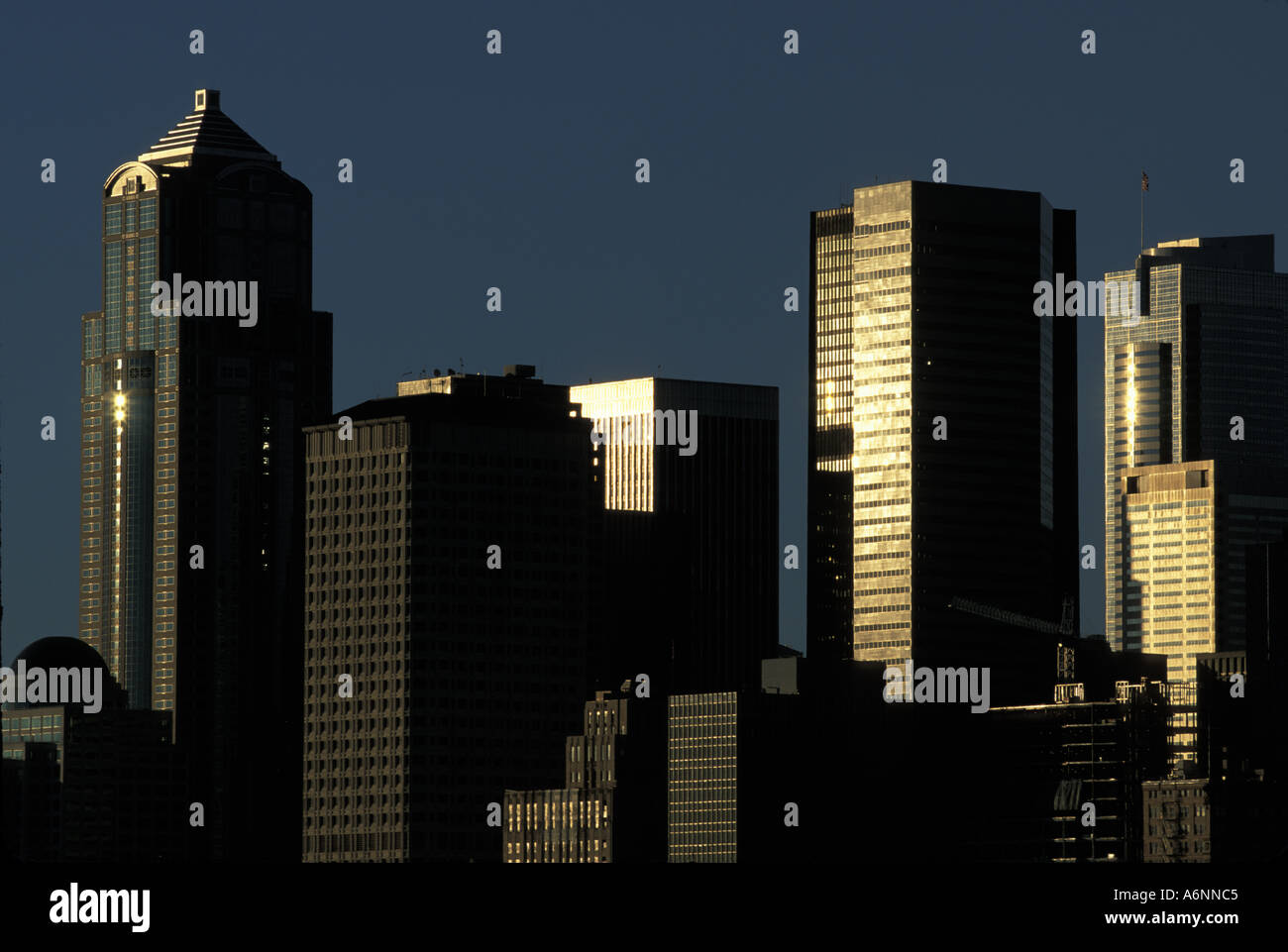 USA Washington Seattle Setting summer sun reflects off office buildings ...