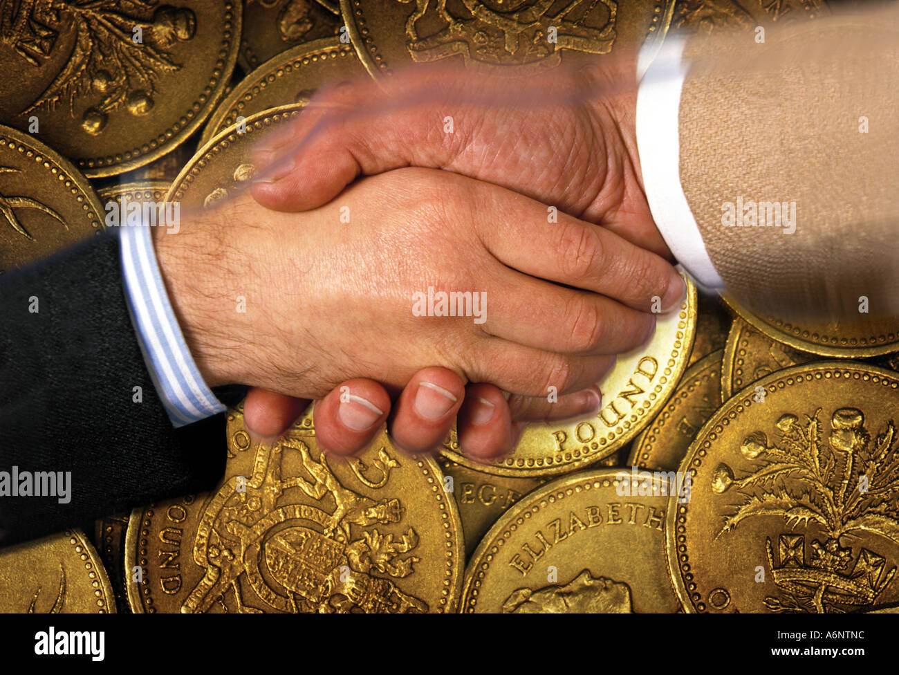handshake Pound coins Stock Photo - Alamy