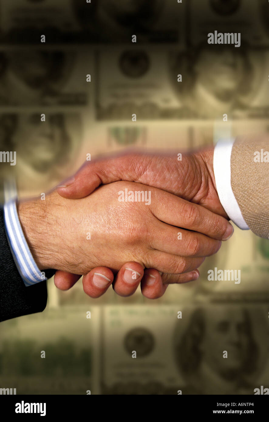 Businessmen making handshake money hi-res stock photography and images ...