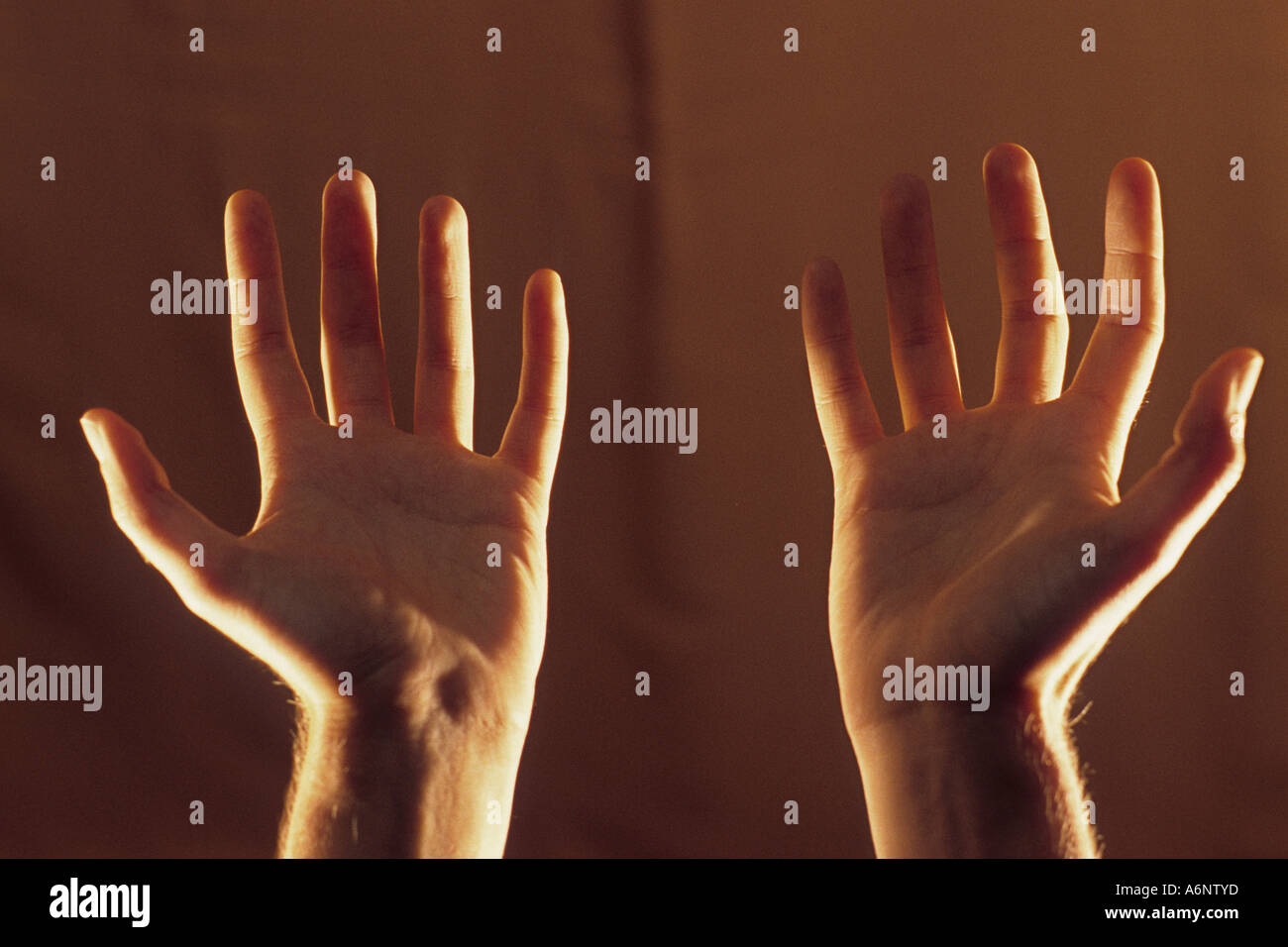 Stretched out hands Stock Photo - Alamy