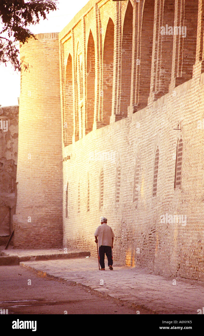 A Man walking along a Street in Bukhara Uzbekistan Asia Stock Photo - Alamy
