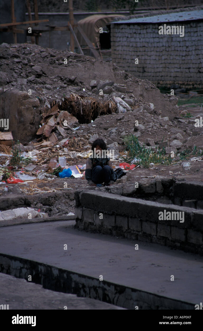 Tibetan street child with garbage South of Golmud Tibet Asia Stock ...