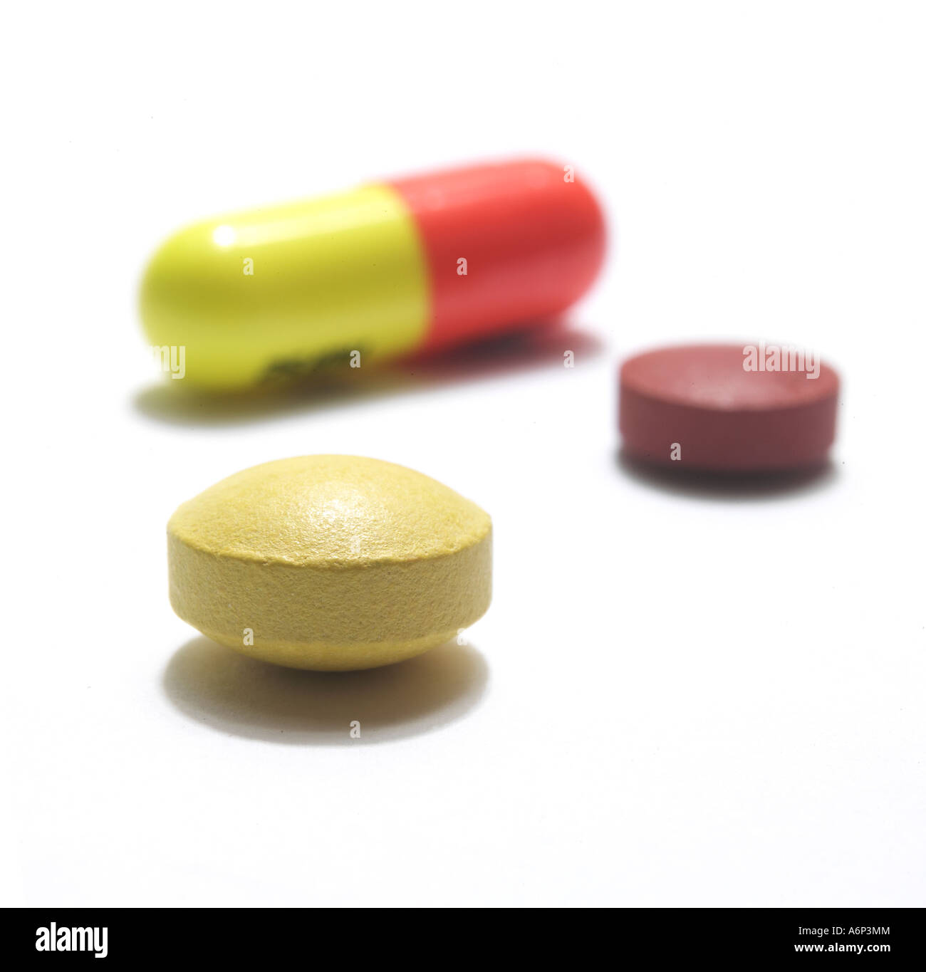 selection of 3 different pills on a white background Stock Photo - Alamy