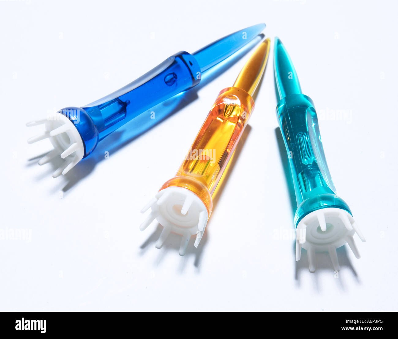 3 golf tees Stock Photo - Alamy