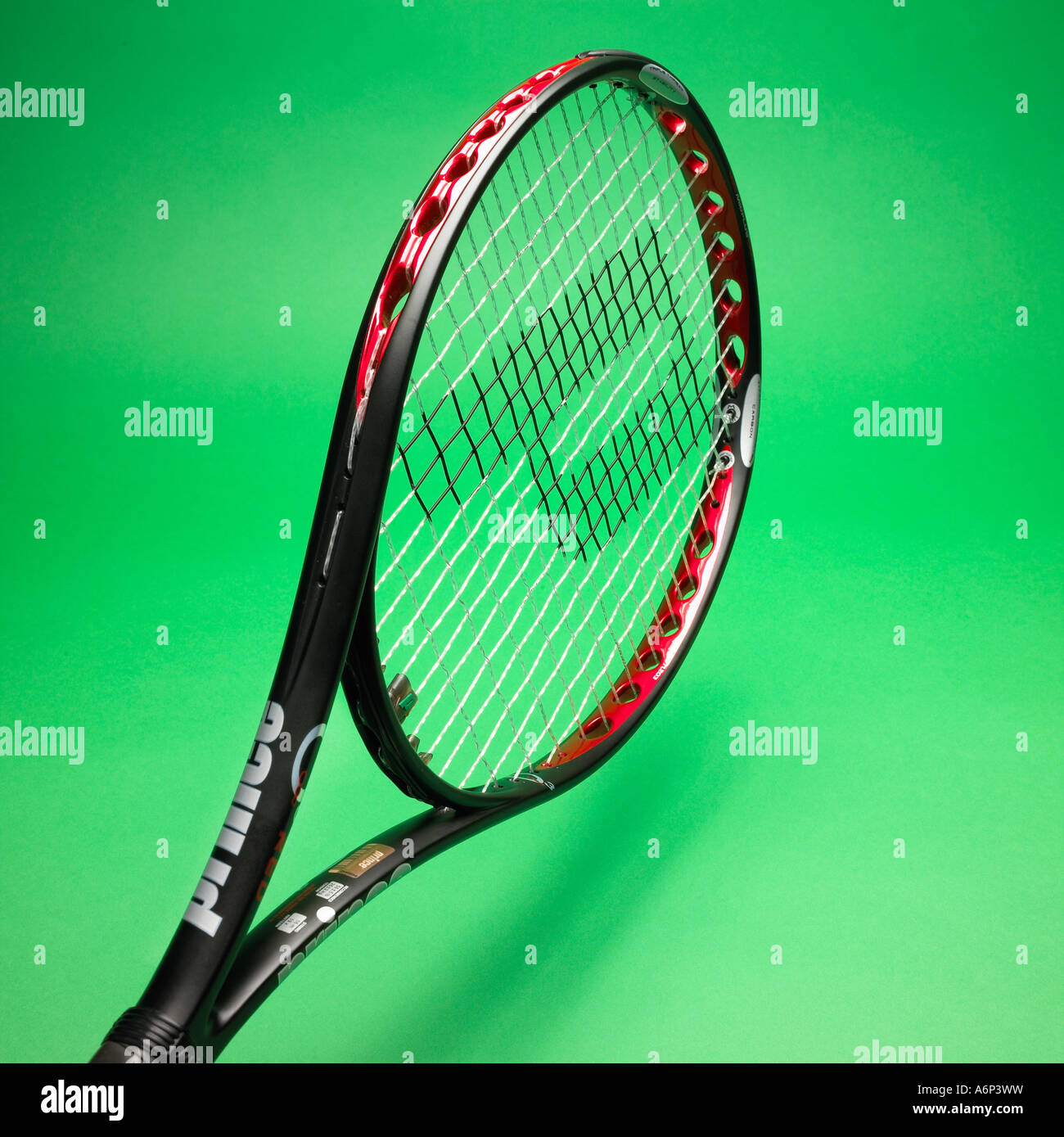 tennis racquet on a green background facing right Stock Photo - Alamy