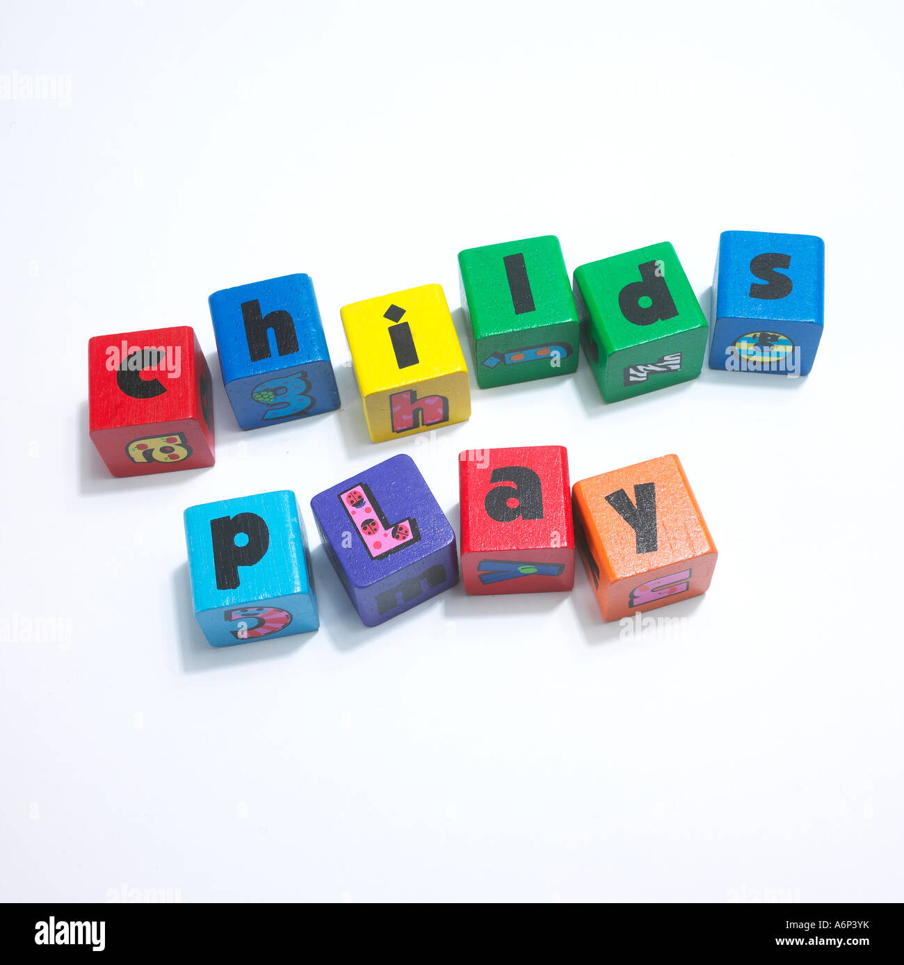 children's building blocks spelling out child's play on a white ...