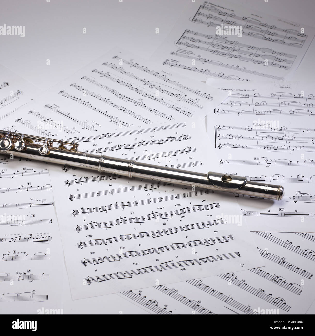 A flute sits on sheet music Stock Photo - Alamy