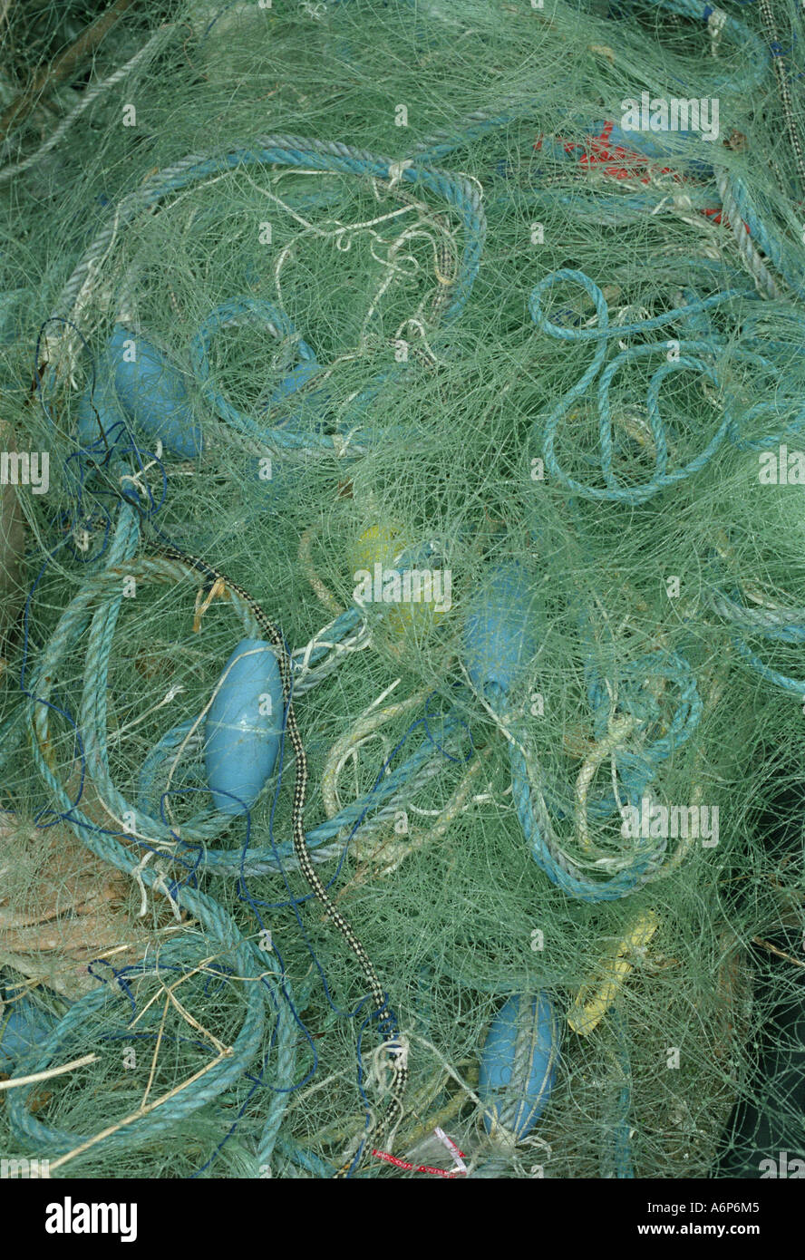 Fisherman's blue tangled messy netting Stock Photo - Alamy