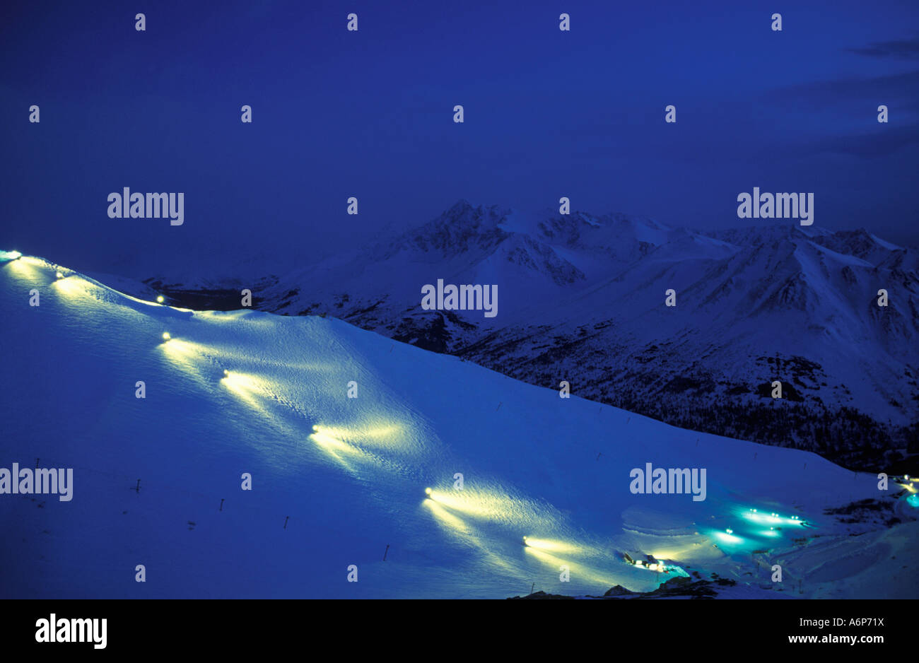 Ski piste lit up for day time skiing in the depth of winter at the ski ...
