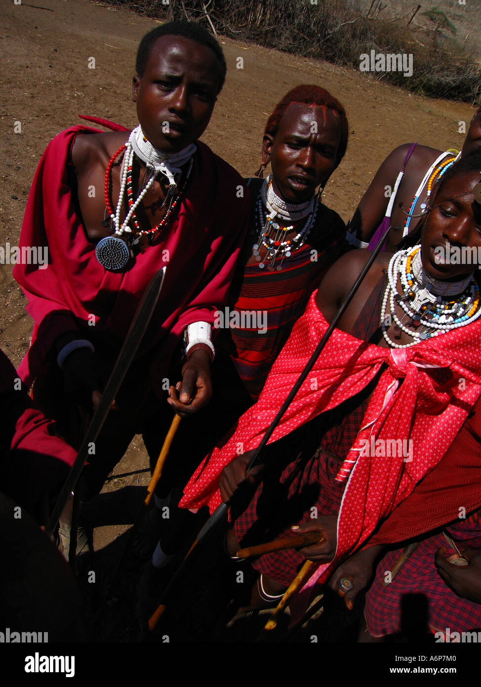 Dancing Maasai Morani warriors enjoying some music and taking it easy ...
