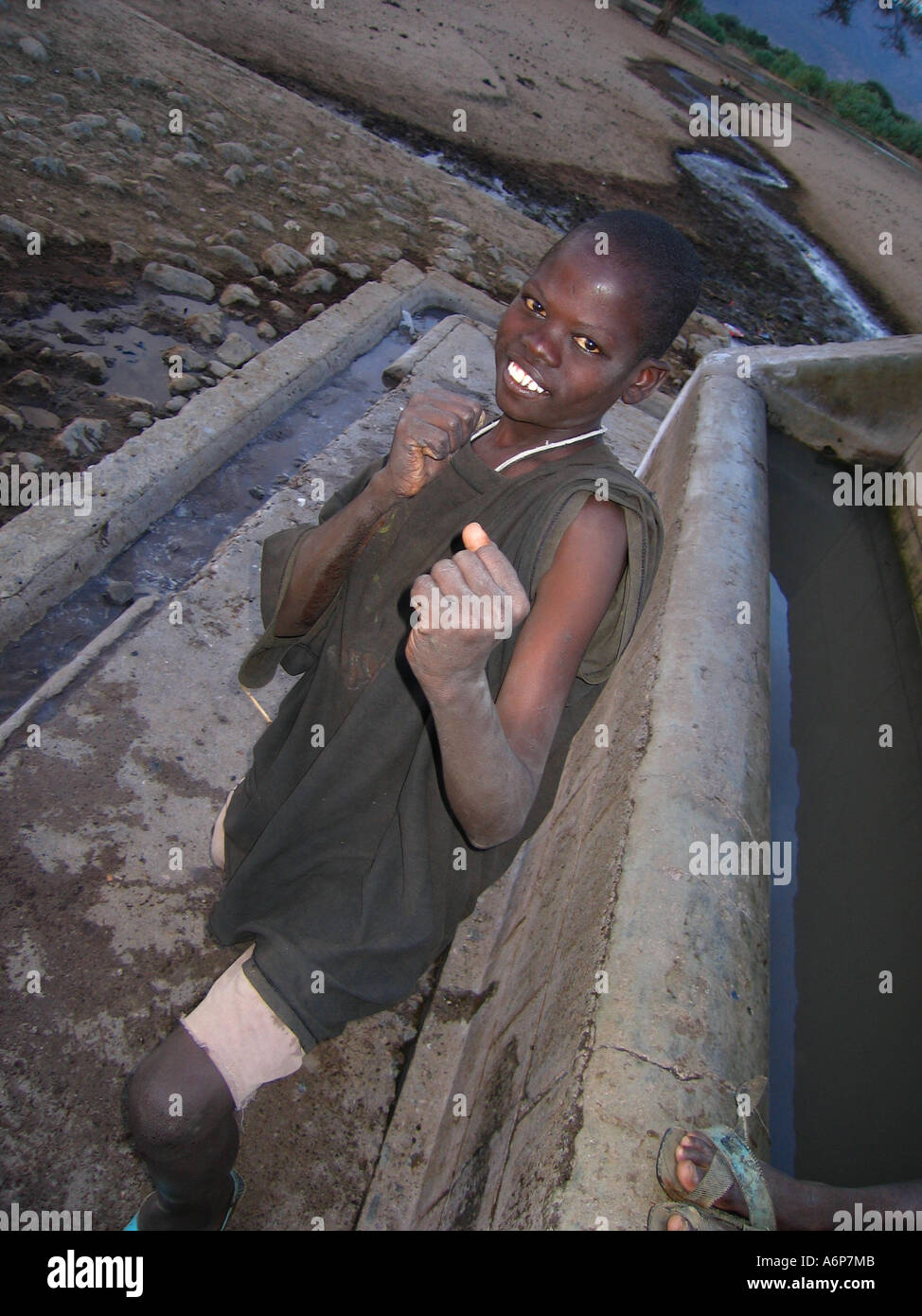 A young Maasai boy plays tough for the camera Stock Photo - Alamy