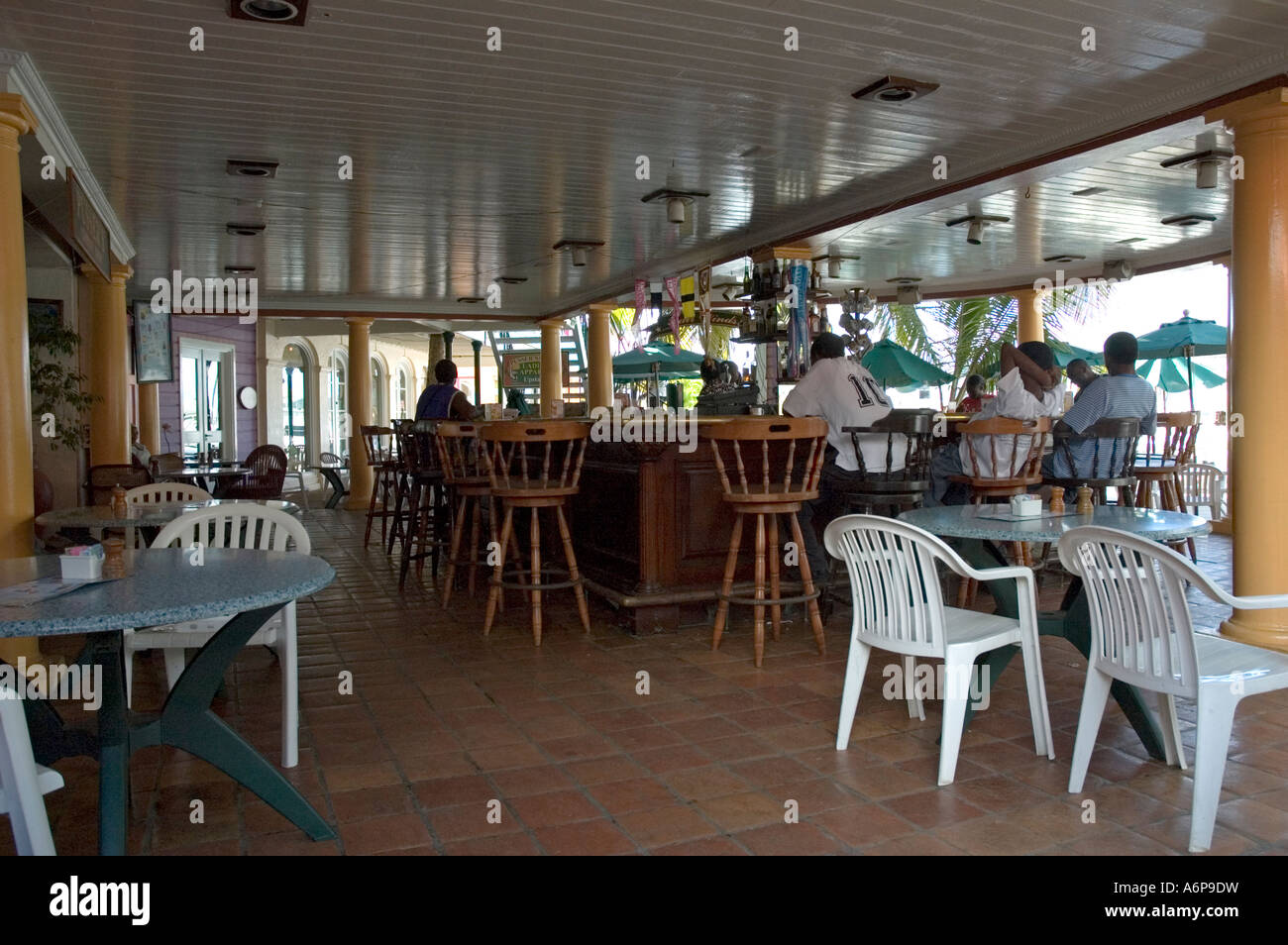 A shady bar and restaurant at Pusser' Landing, Tortola Stock Photo - Alamy