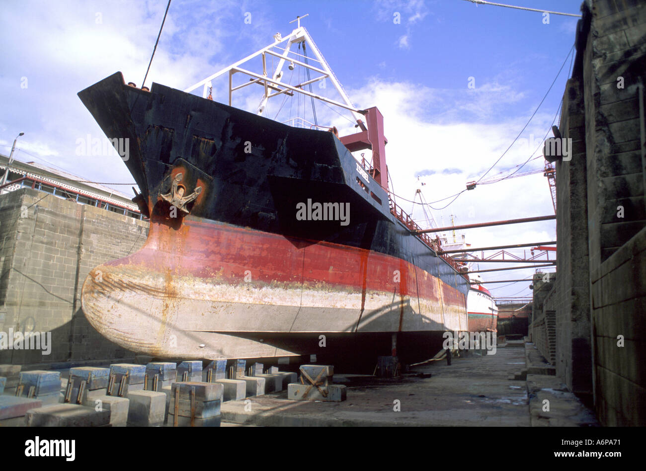 A cargo ship undergoes maintenance work in dry dock Stock Photo - Alamy