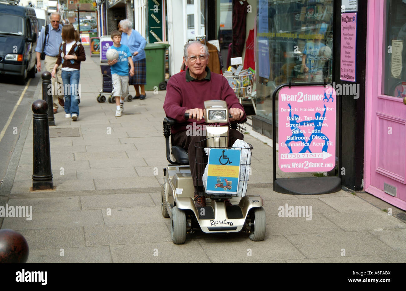 Electric powered mobility scooter Disabled driver in a shopping centre ...