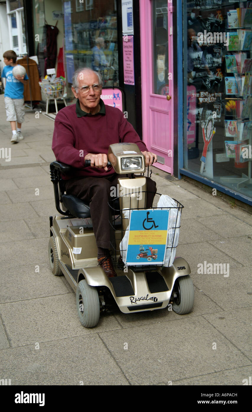 Electric powered mobility scooter Disabled driver in a shopping centre ...