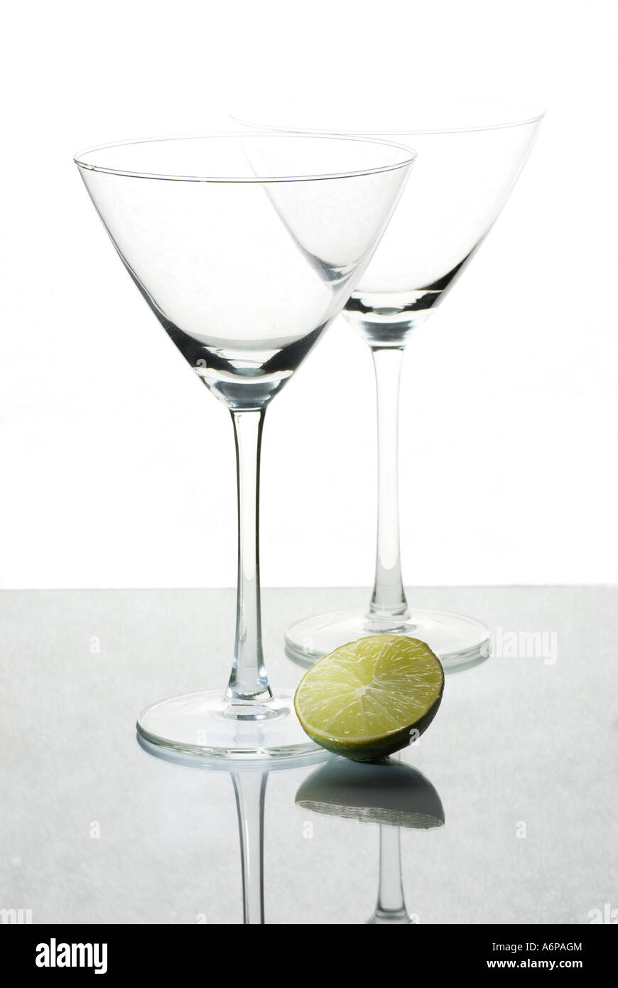Empty cocktail glasses and lime Stock Photo - Alamy