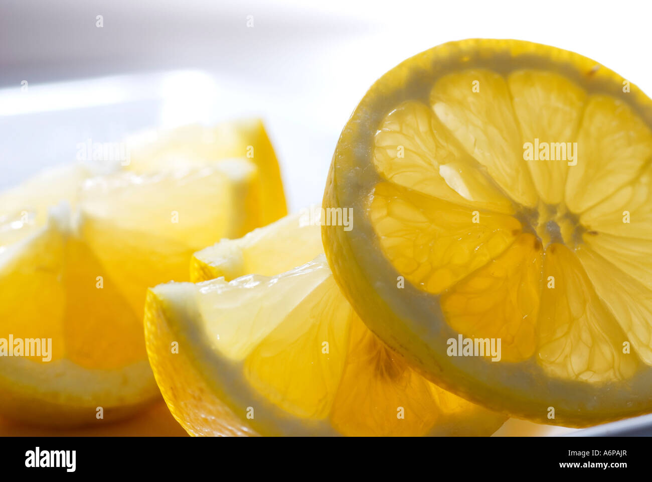 Sliced lemons backlit Stock Photo - Alamy
