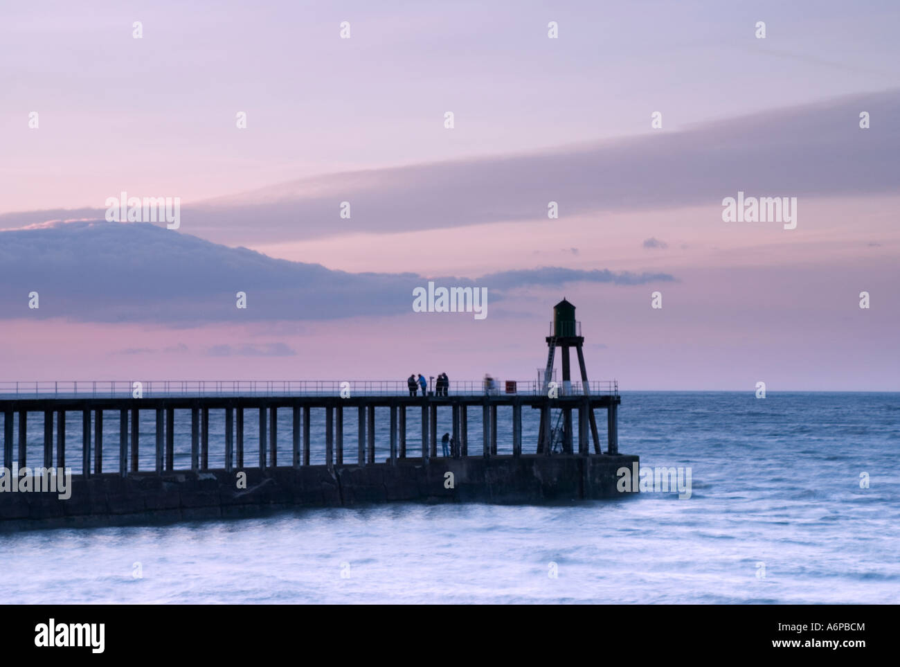 Whitby West Pier sunset, from East Pier Stock Photo - Alamy