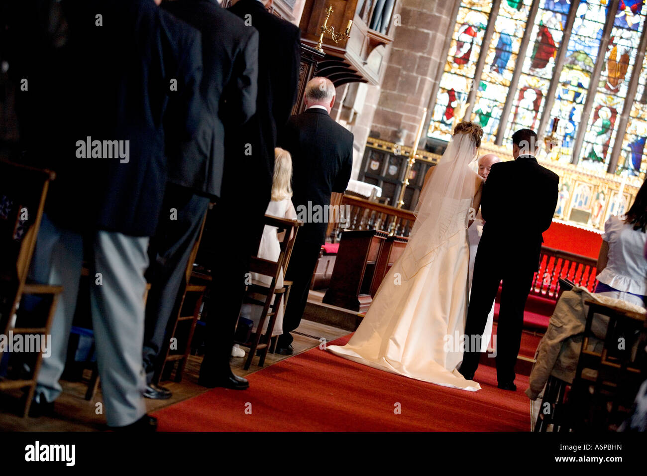 Bride and Groom getting married in church Stock Photo - Alamy