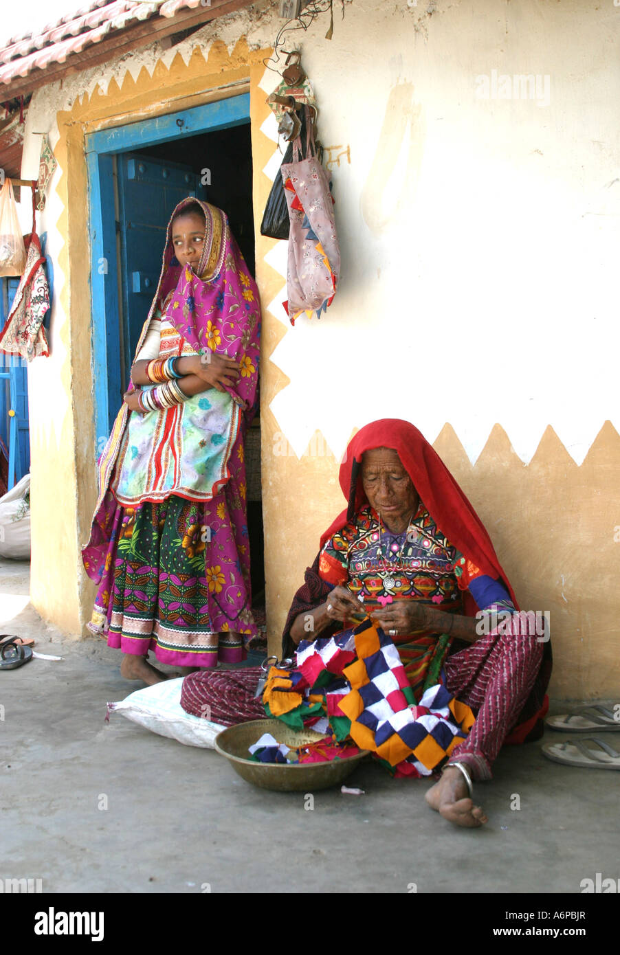 Vividly colorful traditional dress of a Tribal women in a Banni Village ...