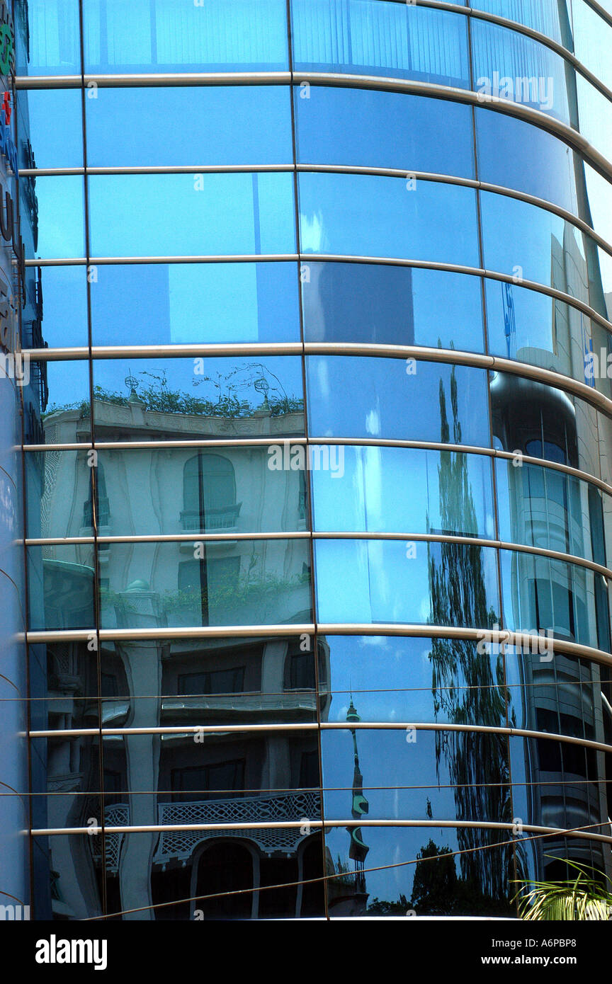 Reflection of building on RMZ Corp RMZ Titanium glass building ...