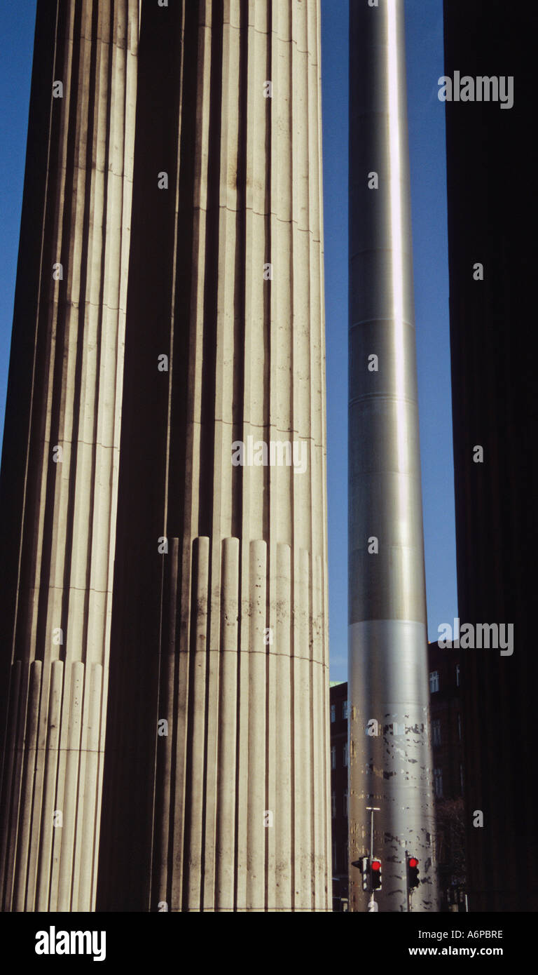 The Dublin Spire in contrast to the columns at the entrance to the post ...