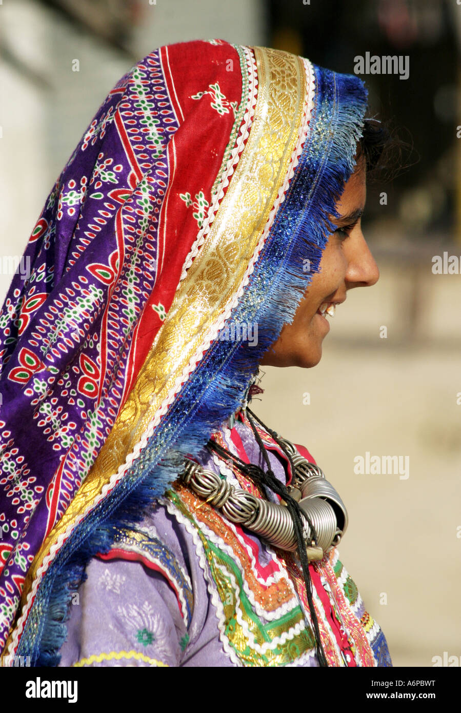 Vividly colorful traditional dress of a Tribal woman in a Banni Village ...
