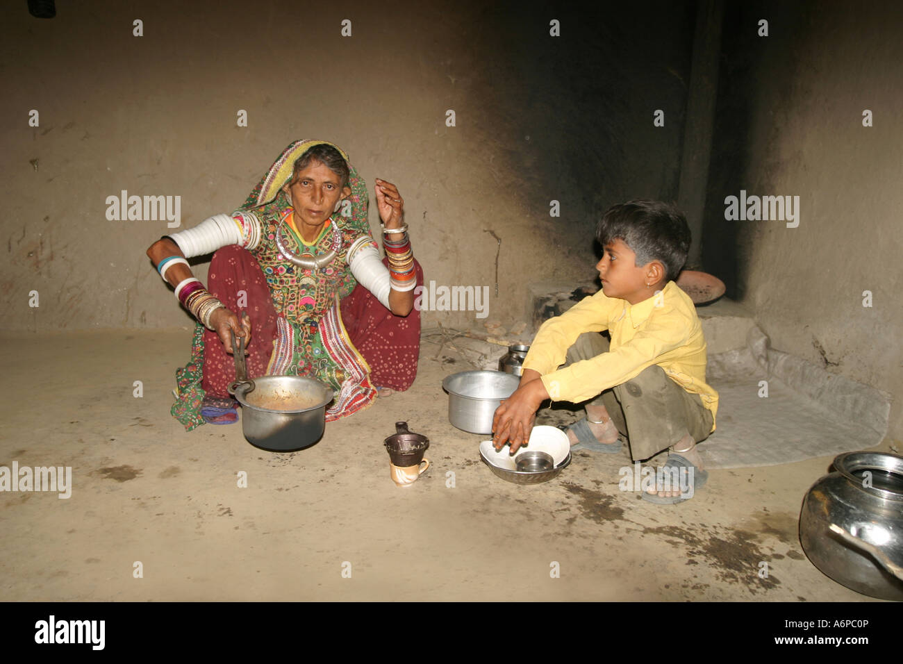 A woman makes tea in Meghwal Bhirindiyara tribal village in the Little ...