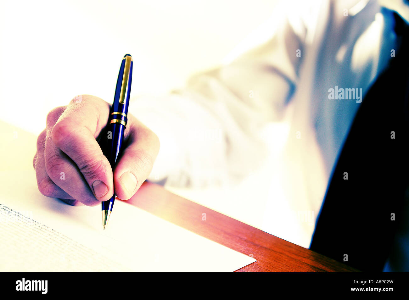 man signing a contract Stock Photo - Alamy