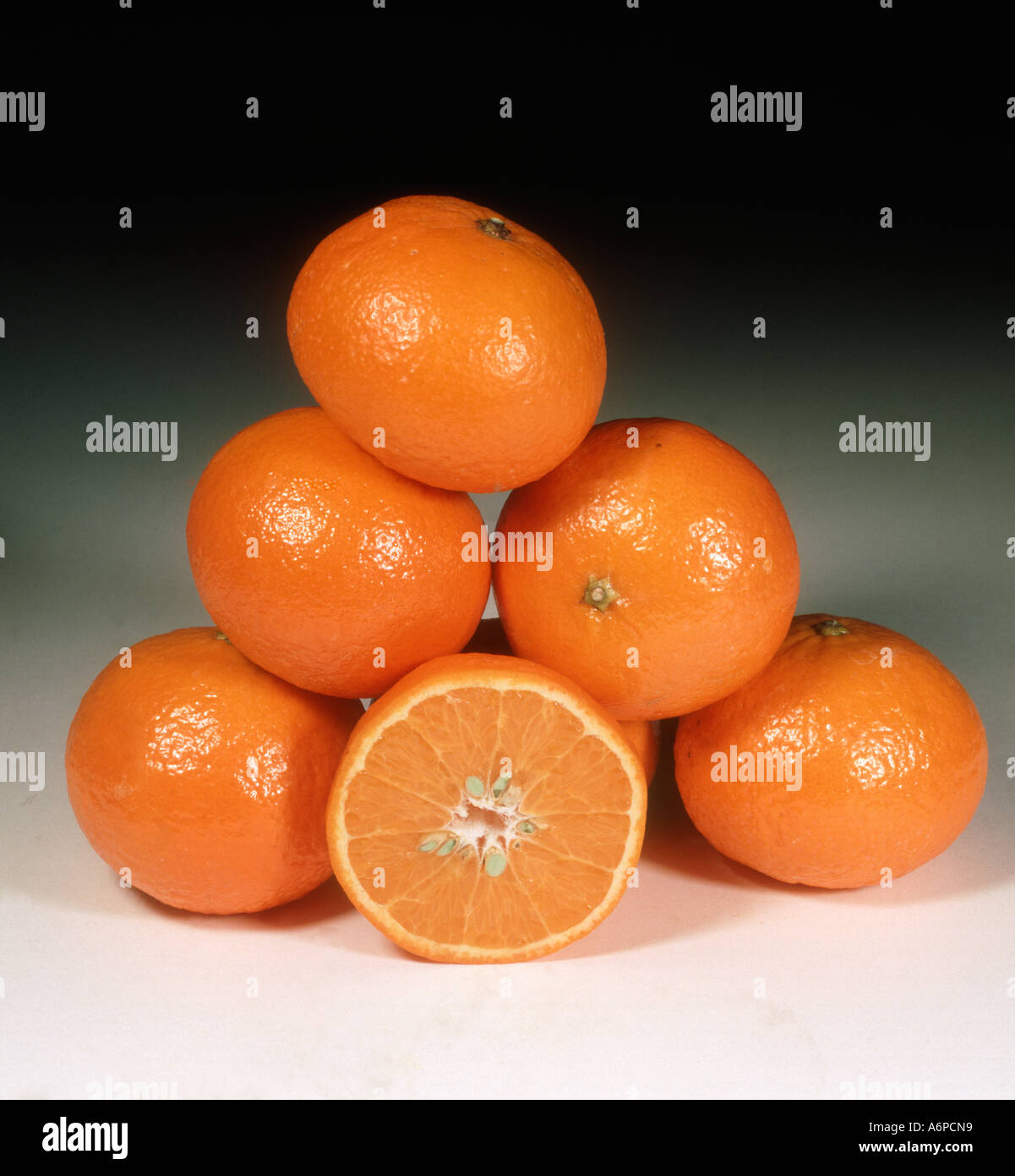 Group of mandarin fruit whole sectioned variety Nova Stock Photo - Alamy